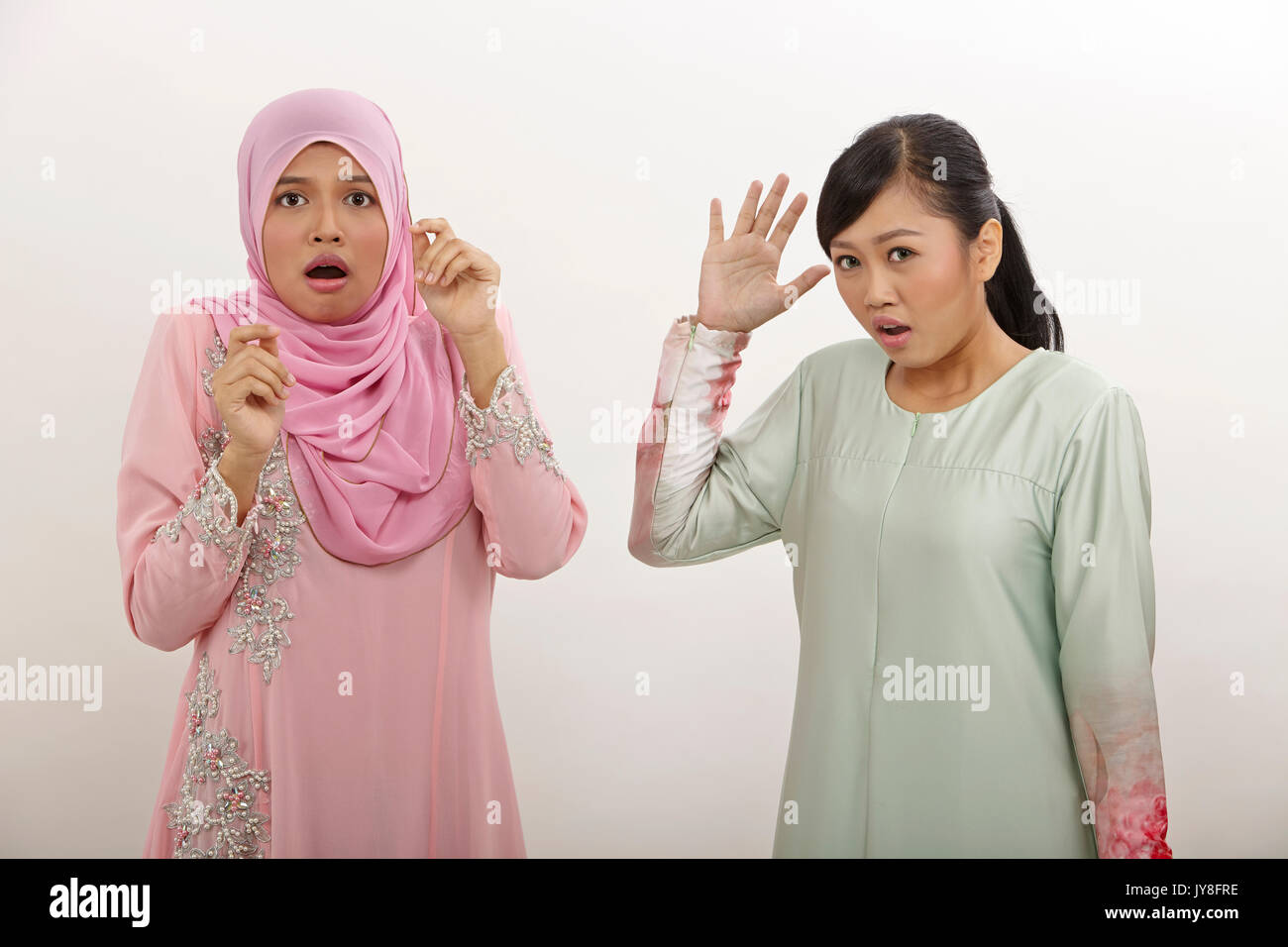 two malay women with scared expression Stock Photo - Alamy