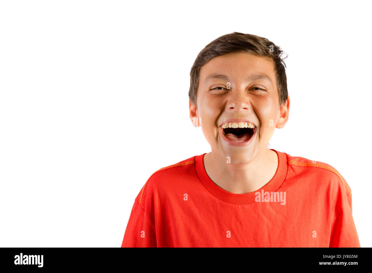 Young teenage boy isolated on white roaring with laughter Stock Photo ...