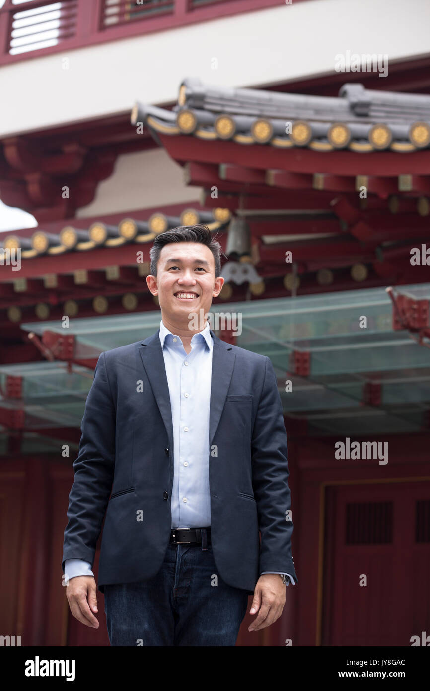 Chinese business man in Asian city. Asian businessman smiling and ...