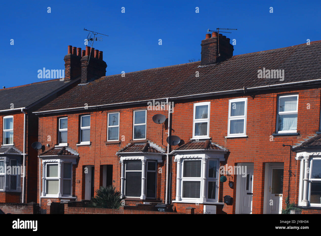 English modern brick terrace building with blue sky background, Spring ...