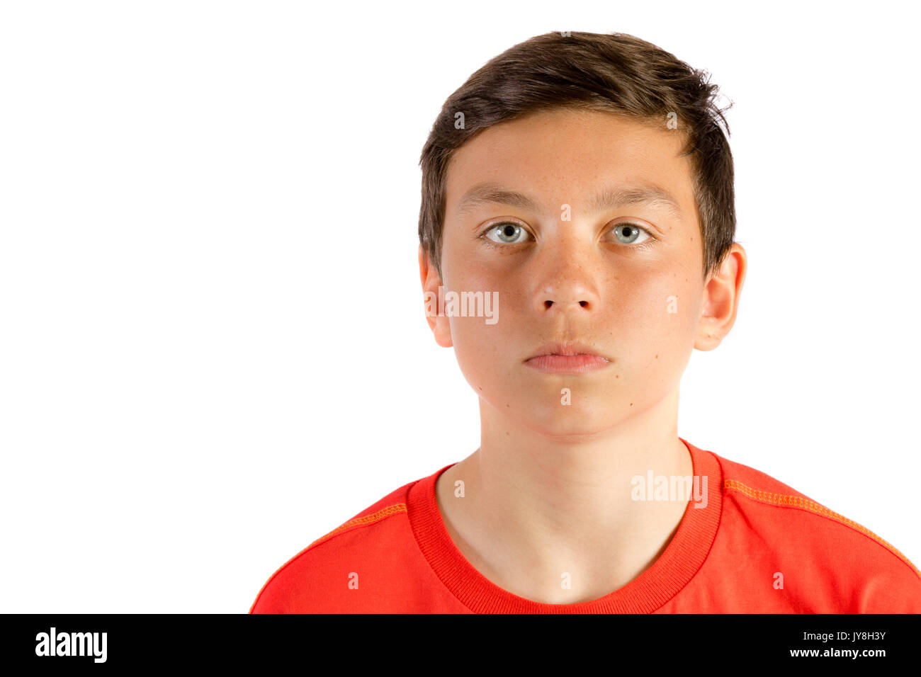 Young teenage boy isolated on white looking forward Stock Photo - Alamy