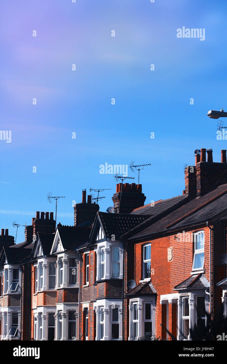 Row of British bricks terraced houses with a lovely colorful sky ...