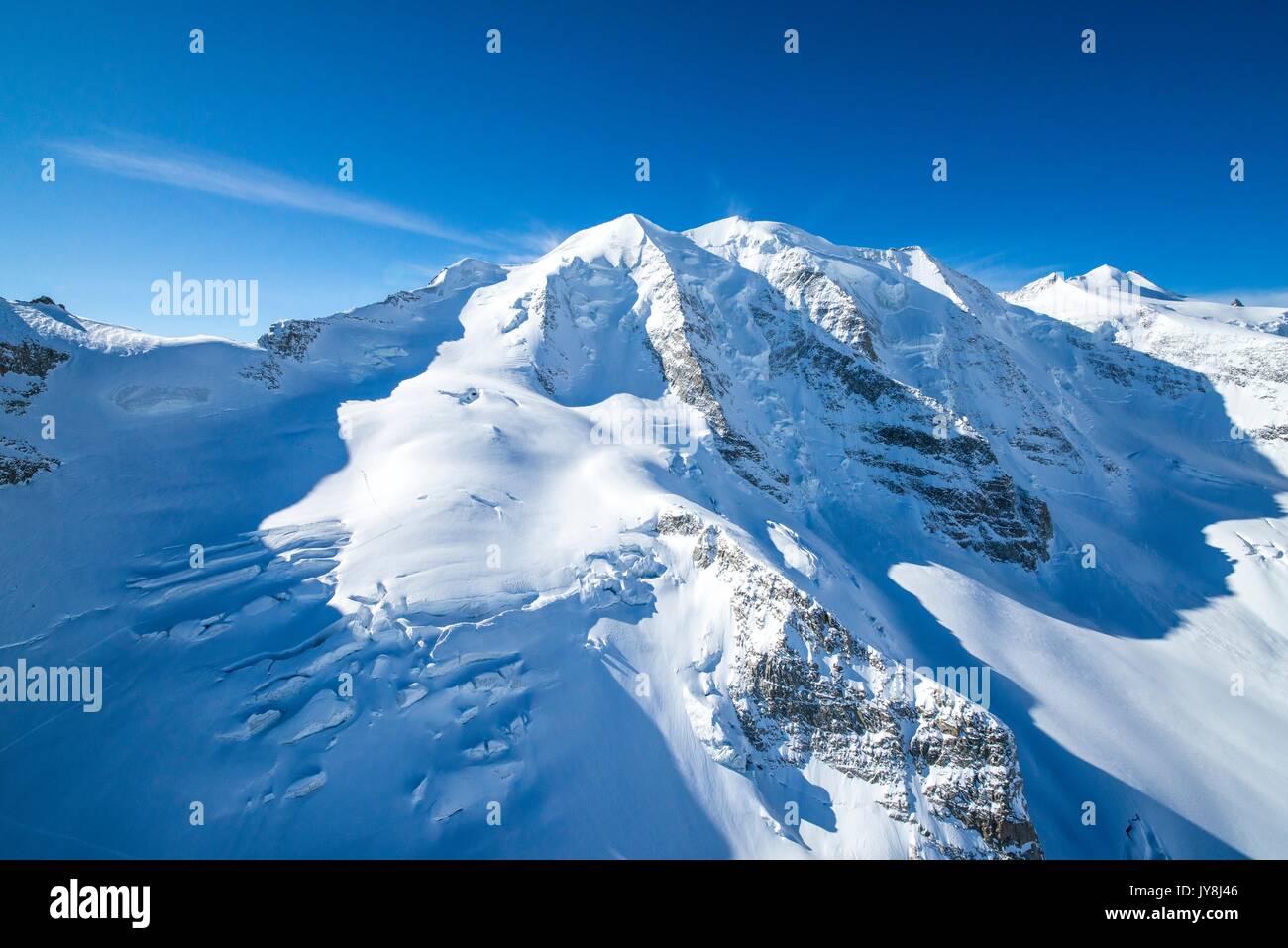 Aerial view of Piz Palù with the crevasses of its glacier, Val Roseg ...