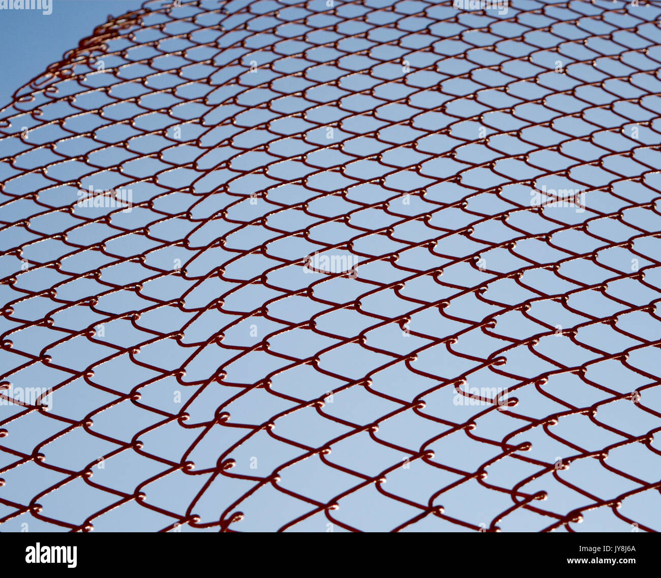 Red net fence textures with sky background Stock Photo - Alamy