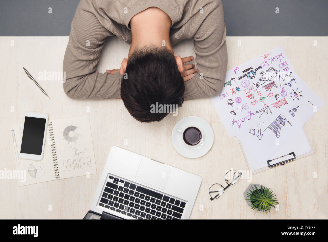 Young businessman sleeping in front of computer at desk Stock Photo - Alamy