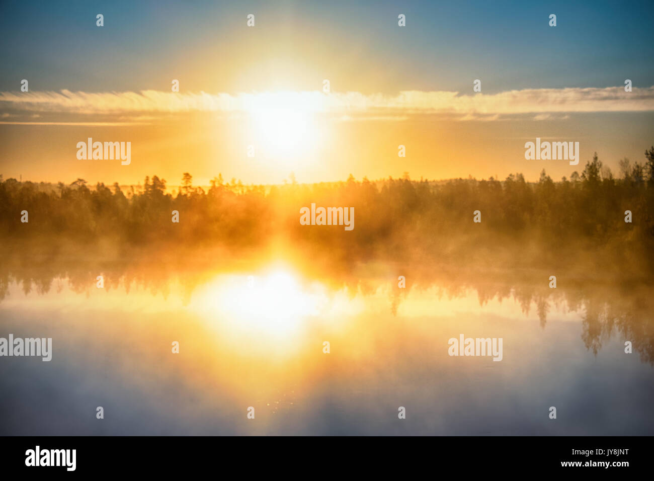 Spectacular dawn (positive mood). Fog creeps over river on rising sun ...