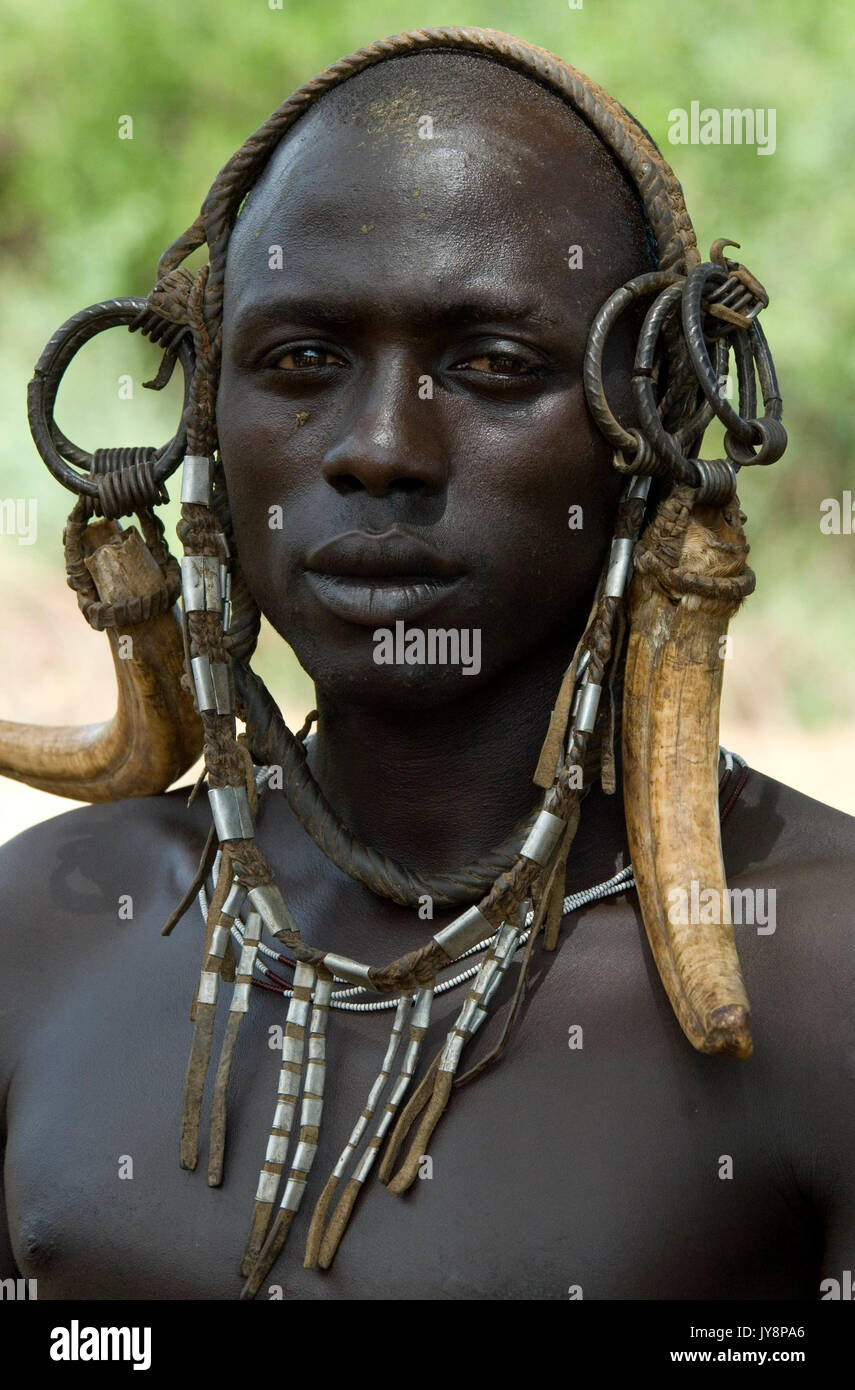 Young Man wearing head gear, Mursi Tribe, Mago National Park, Lower Omo ...