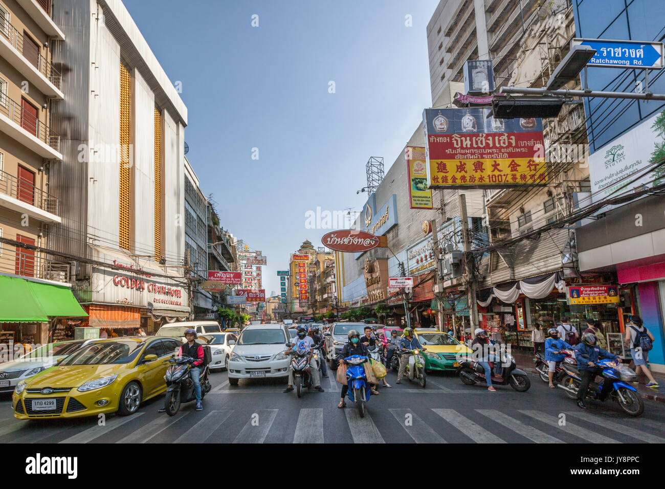 Chinatown District with its typical lit signs and traffic on Thanon Yaowarat road, Bangkok ...