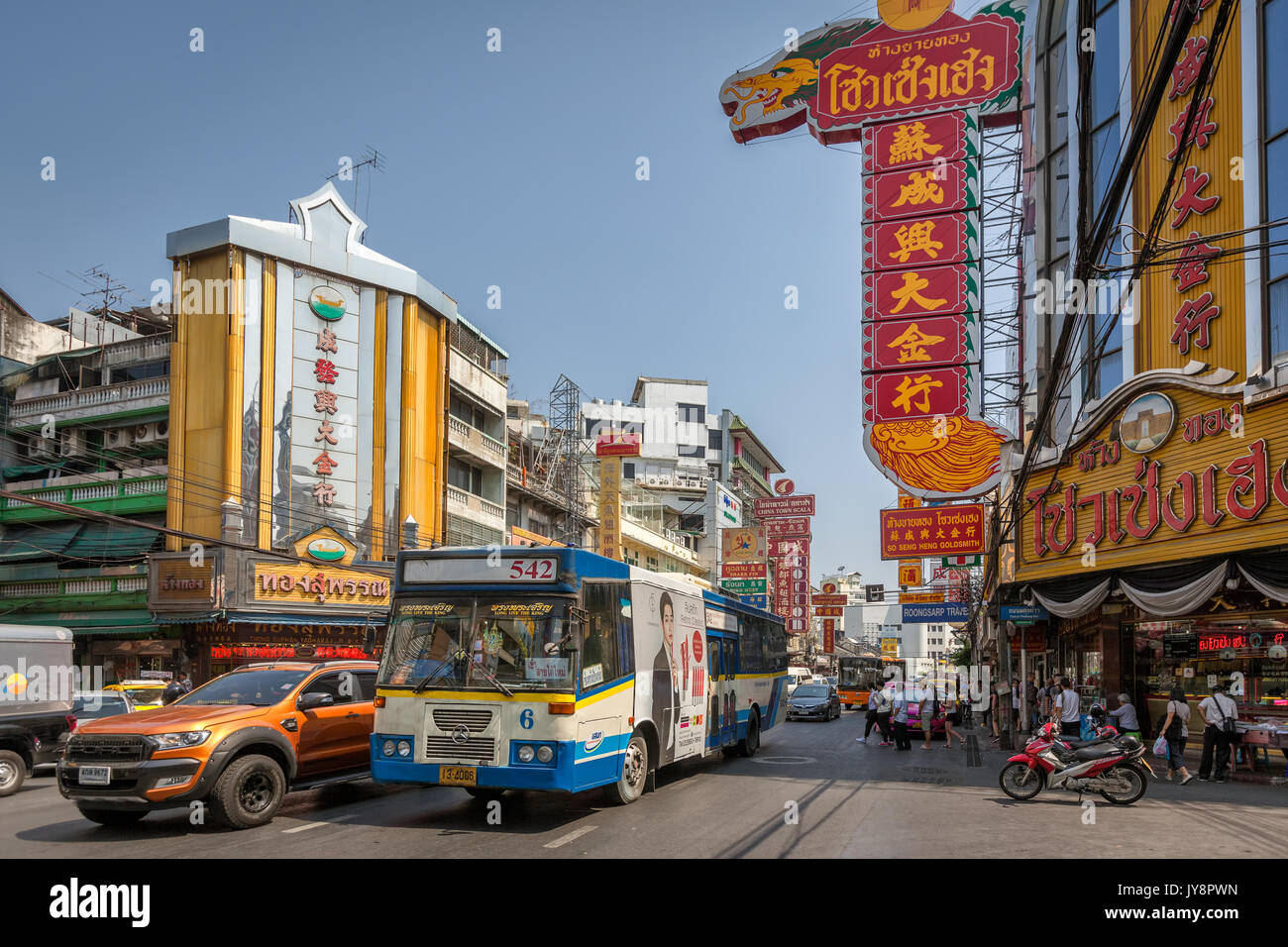 Chinatown District with its typical lit signs and traffic on Thanon Yaowarat road, Bangkok ...