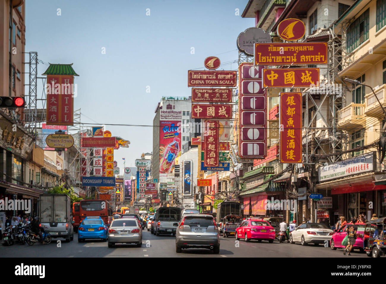 Chinatown District with its typical lit signs and traffic on Thanon Yaowarat road, Bangkok ...