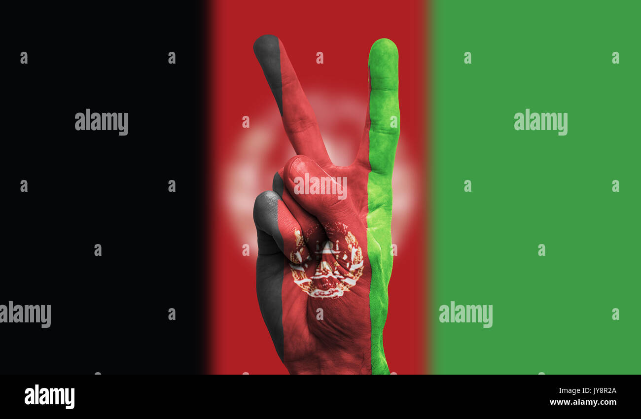afghanistan national flag painted onto a male hand showing a victory ...