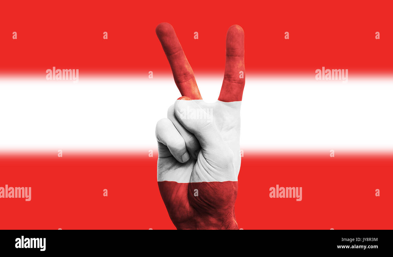 austria national flag painted onto a male hand showing a victory, peace ...