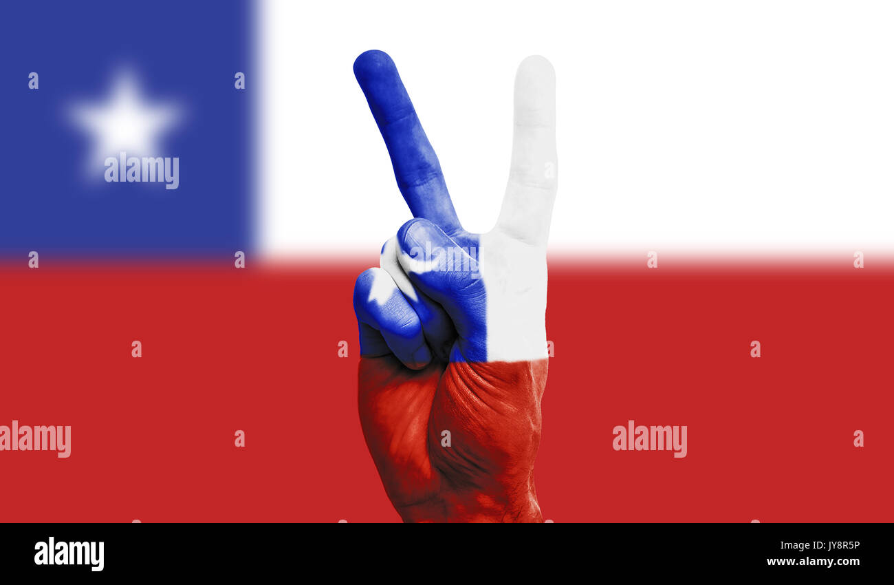 Chile national flag painted onto a male hand showing a victory, peace ...