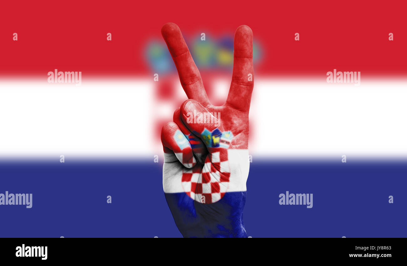 Croatia national flag painted onto a male hand showing a victory, peace ...