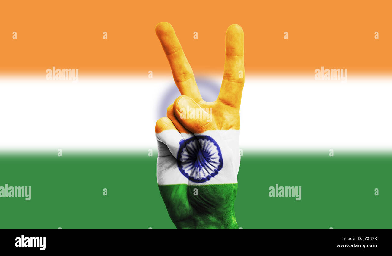 India national flag painted onto a male hand showing a victory, peace ...