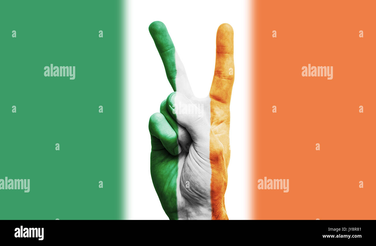 Ireland national flag painted onto a male hand showing a victory, peace ...
