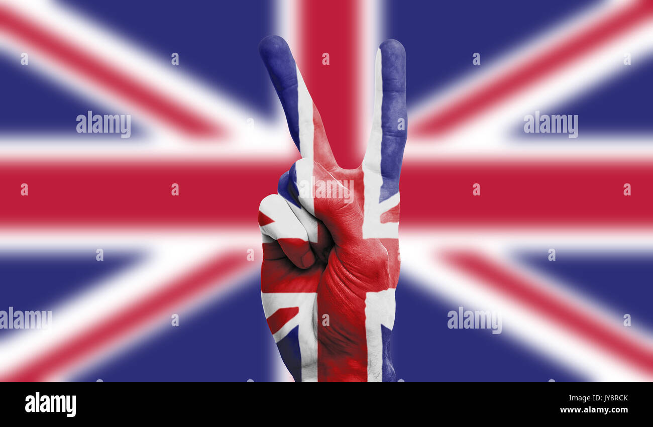 UK national flag painted onto a male hand showing a victory, peace ...