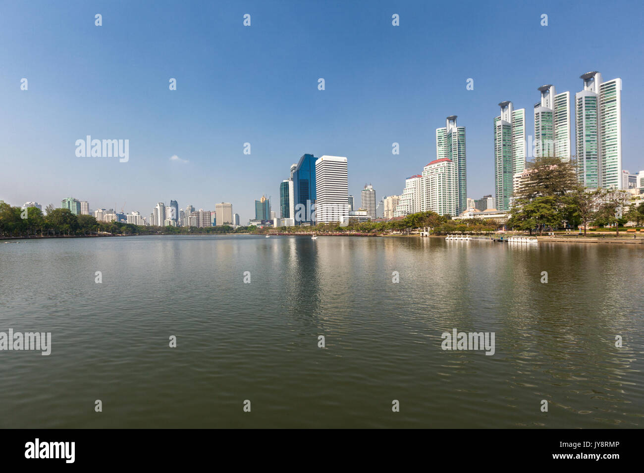 Benjakiti Park in Bangkok, Thailand skyline with Lake Ratchada ...