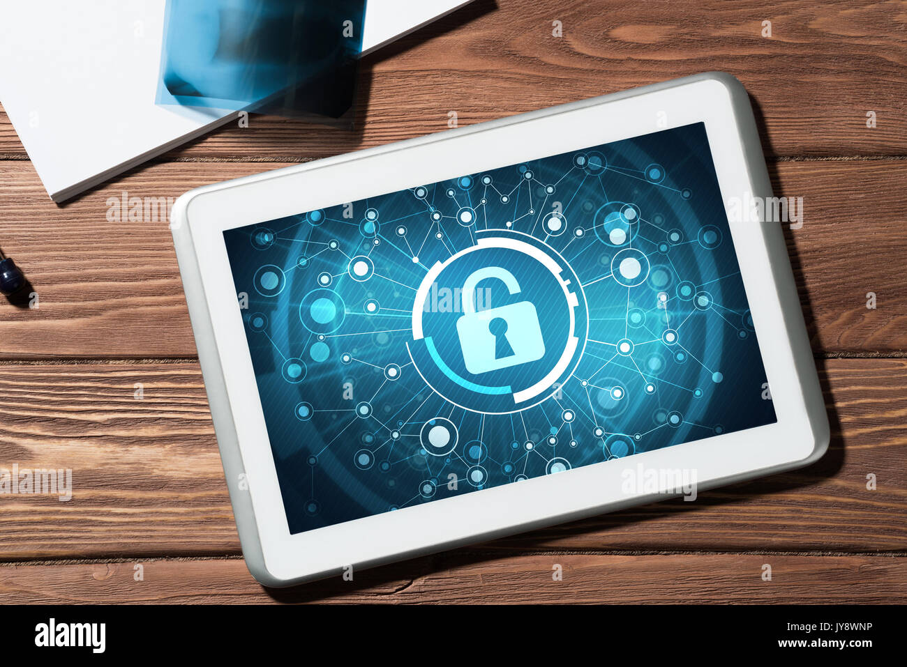 Web security and technology concept with tablet pc on wooden table ...