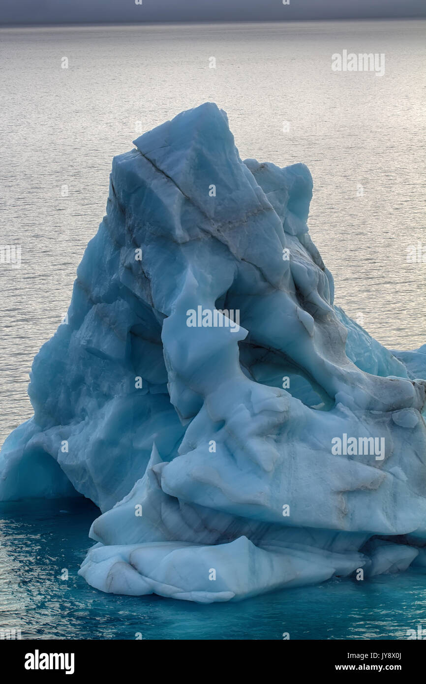 Bergy bit - part of iceberg. Ship sails in immediate vicinity Stock ...