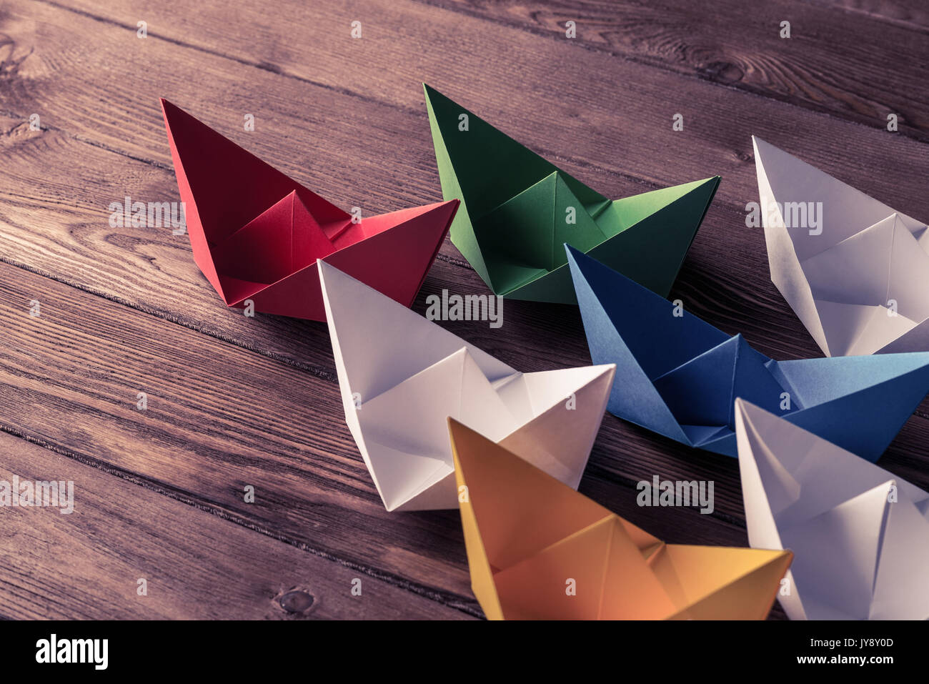 Business leadership concept with white and color paper boats on Stock ...