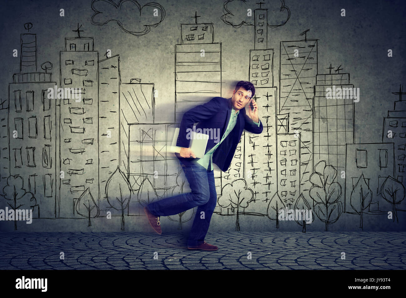 Young man running late to work Stock Photo - Alamy