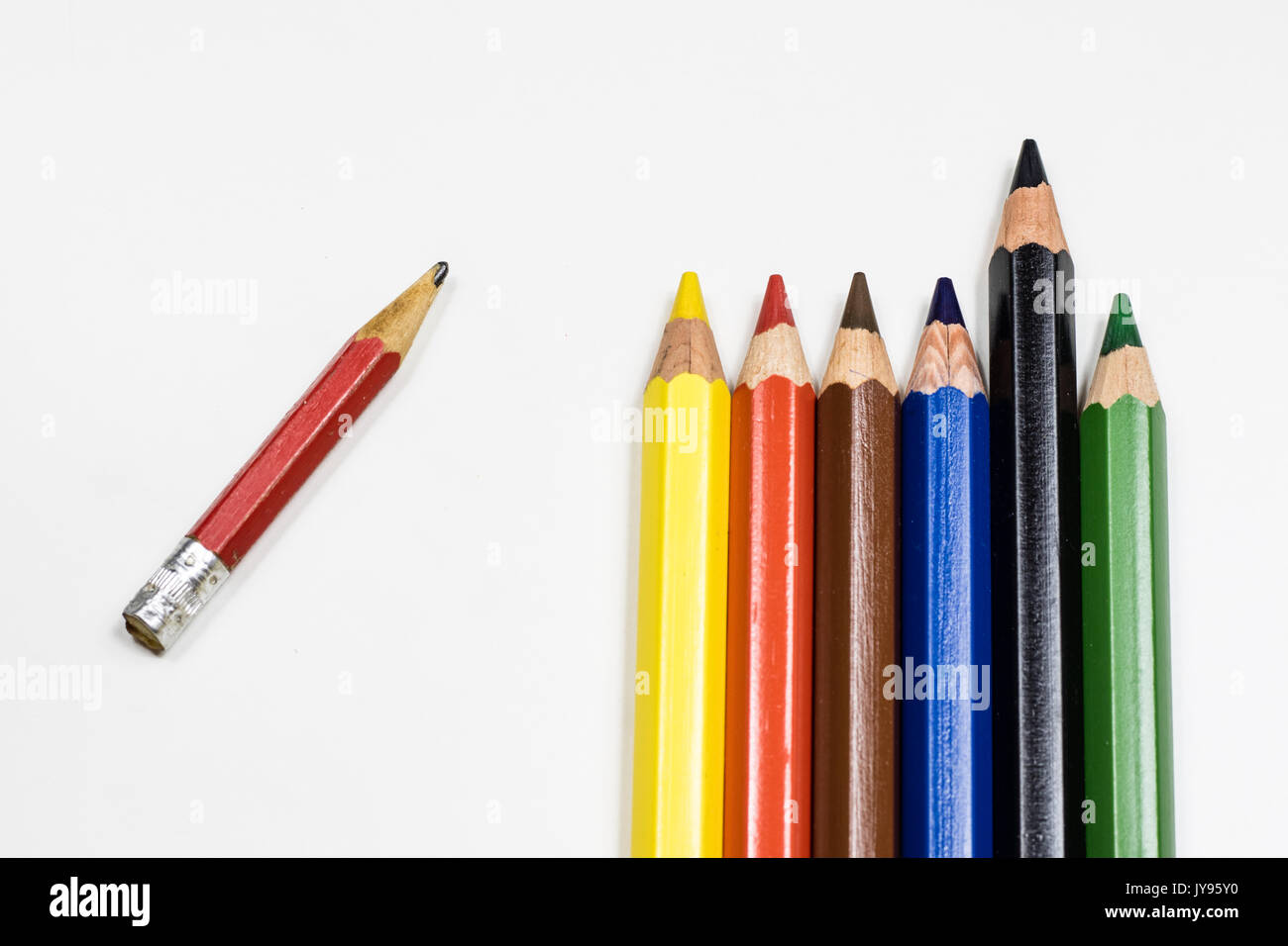 Cute baby pencil crayons on a white table. Isolated background. White ...