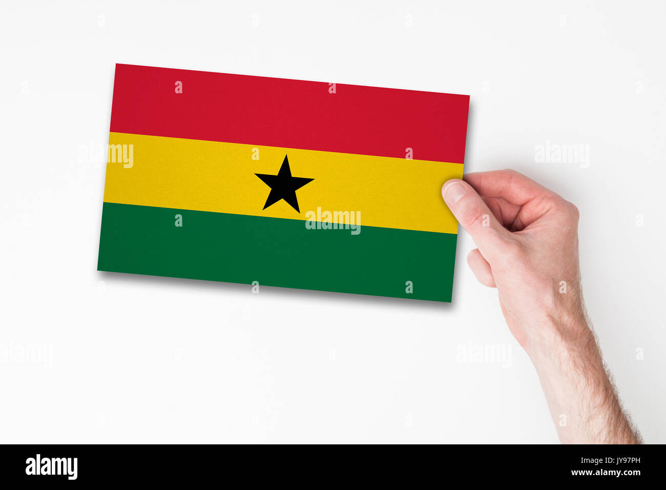 Male hand holding ghana flag Stock Photo - Alamy