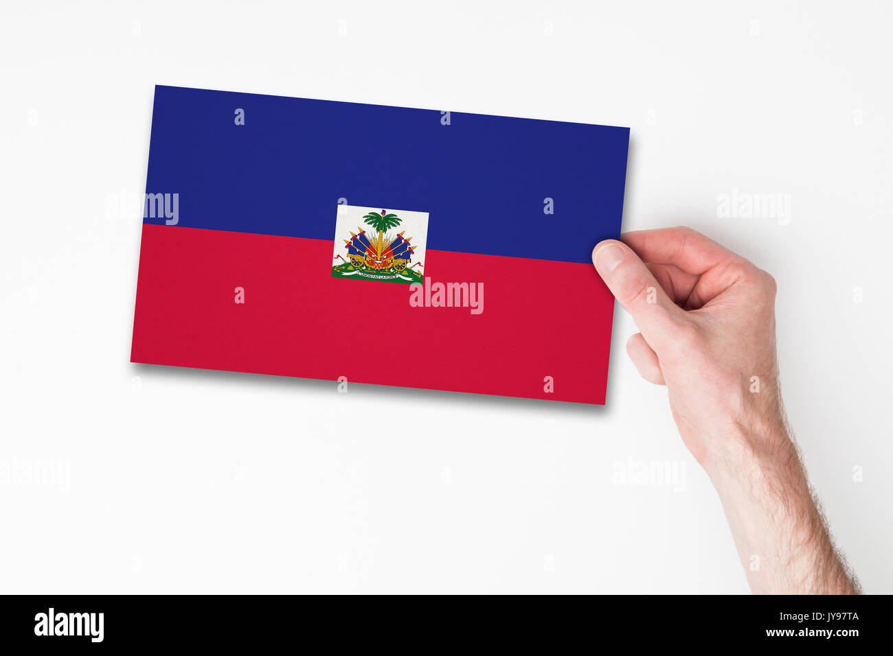 Male hand holding haiti flag Stock Photo - Alamy