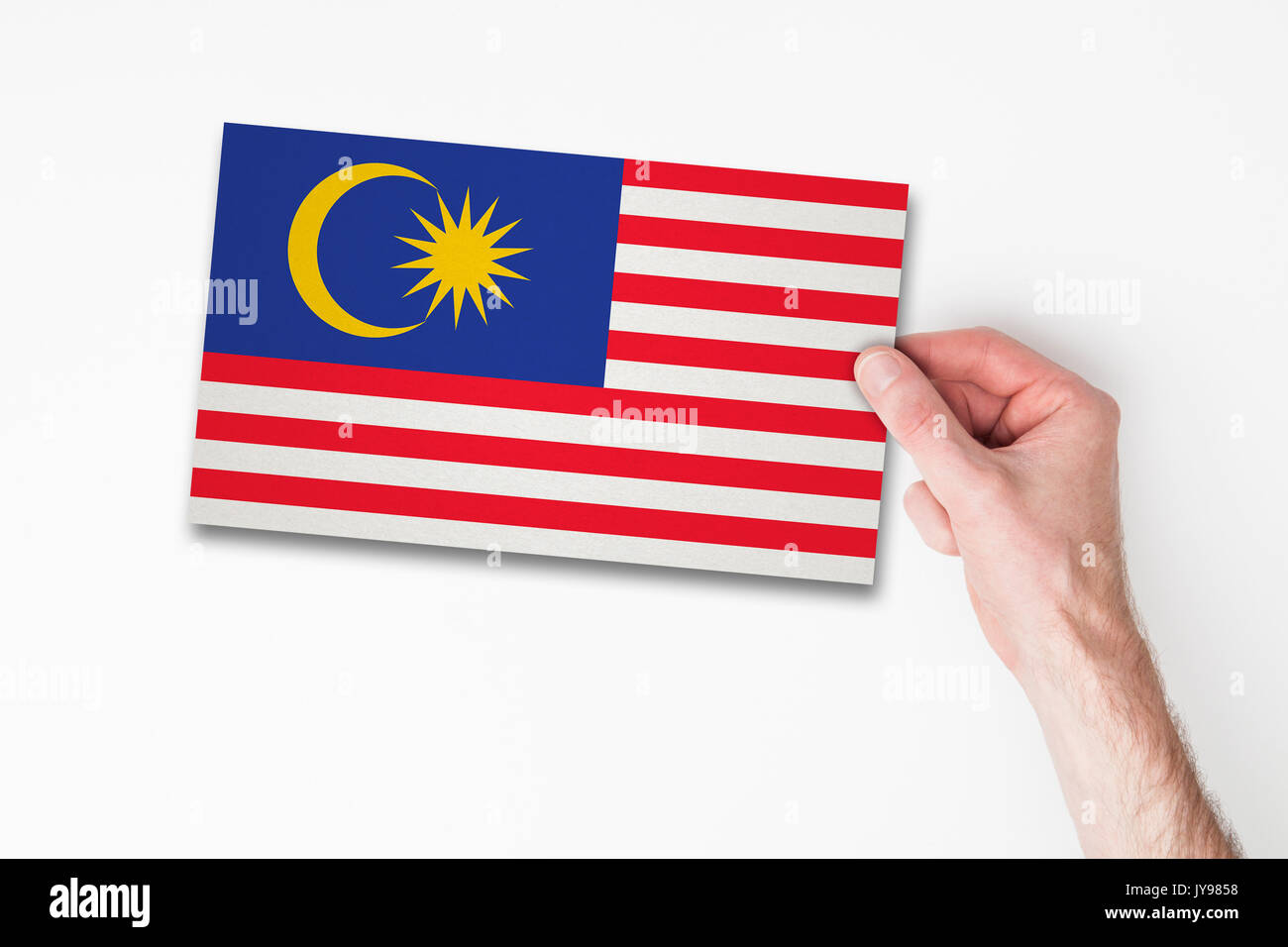 Malaysia flag hand holding hi-res stock photography and images - Alamy