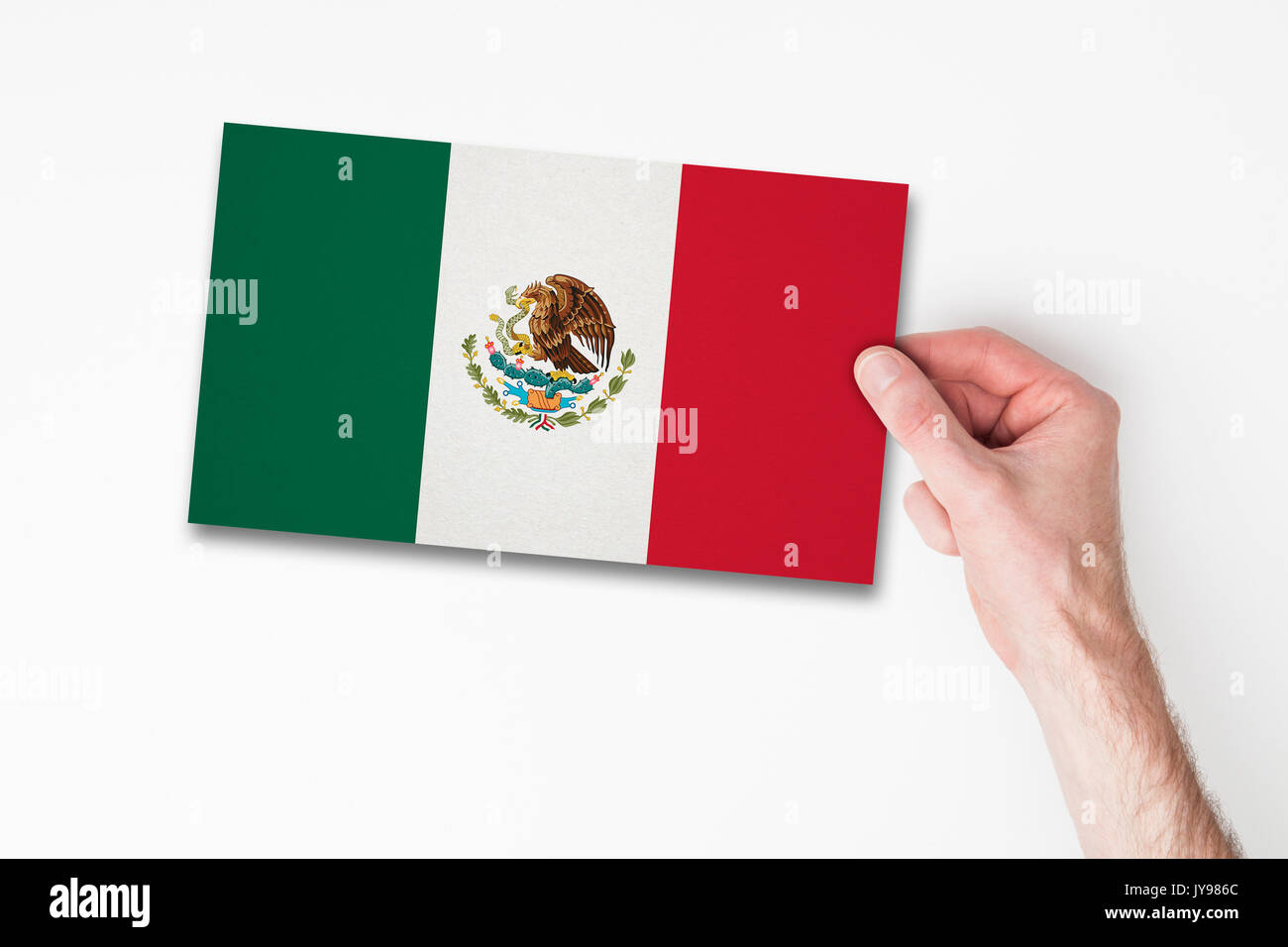 Male hand holding mexico flag Stock Photo - Alamy