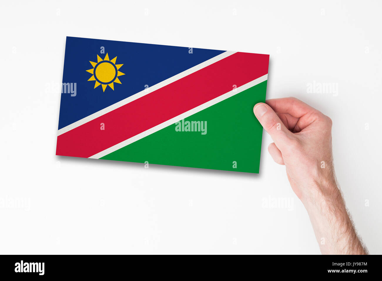 Male hand holding namibia flag Stock Photo - Alamy