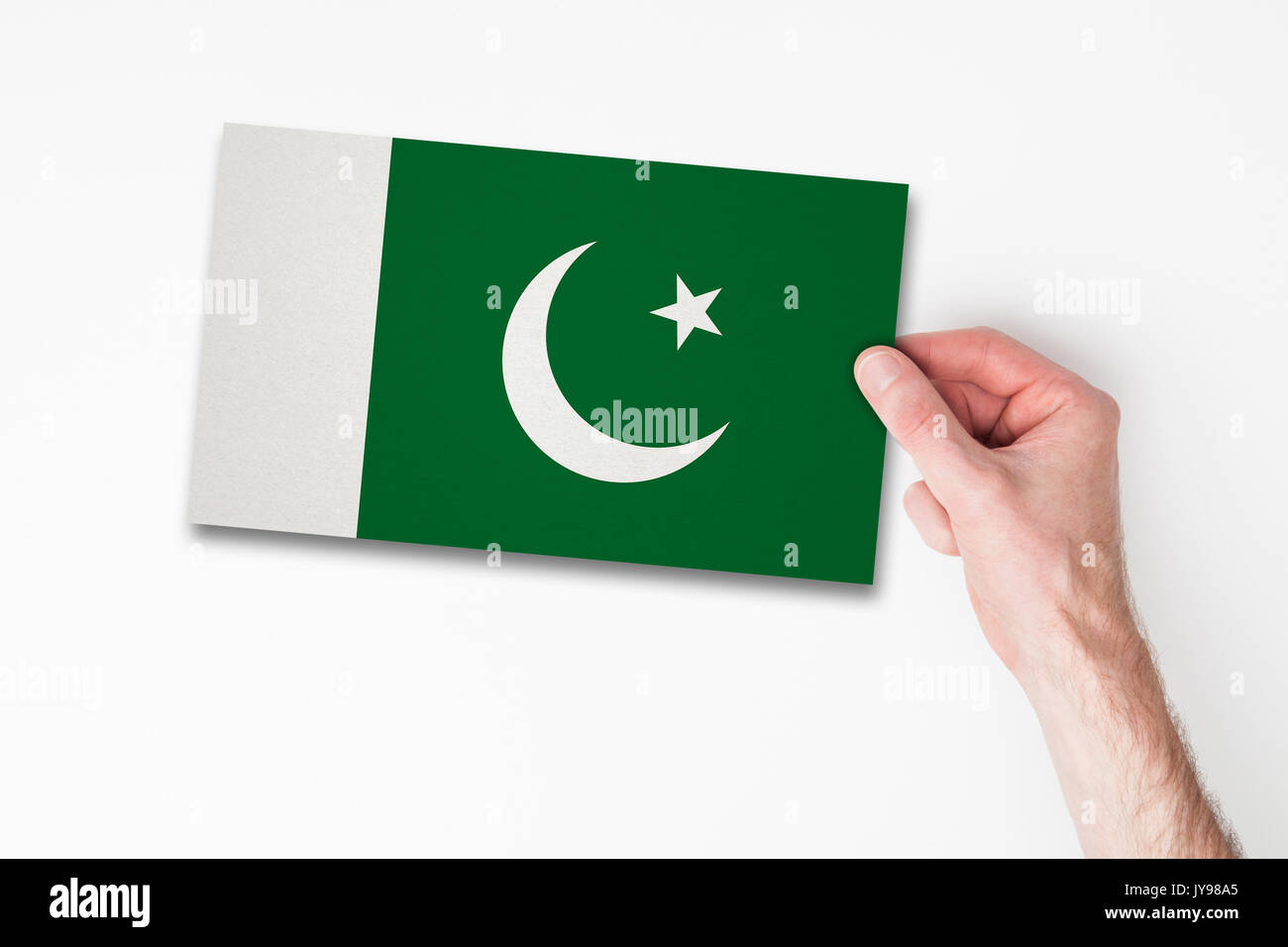 Male hand holding pakistan flag Stock Photo - Alamy