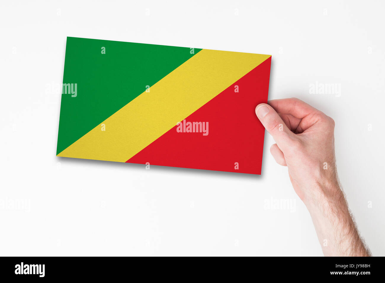 Male hand holding republic of congo flag Stock Photo - Alamy