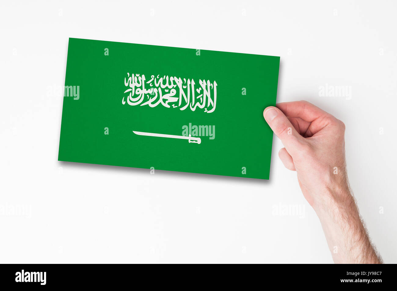 Male hand holding saudi arabia flag Stock Photo - Alamy
