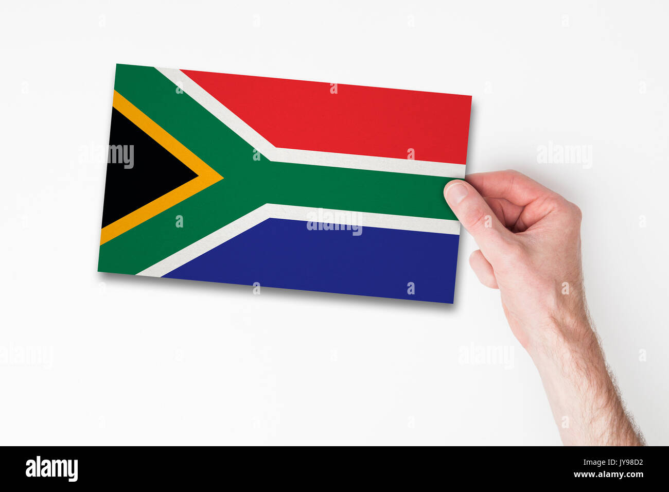Male hand holding south africa flag Stock Photo - Alamy