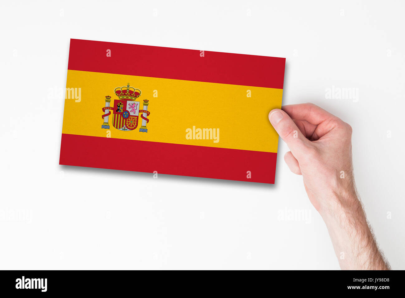 Male hand holding spain flag Stock Photo - Alamy