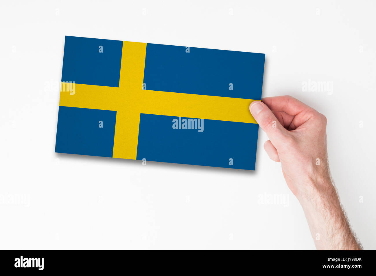 Male hand holding sweden flag Stock Photo - Alamy