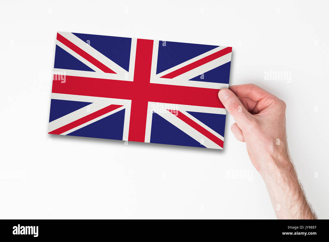 Male hand holding uk flag Stock Photo - Alamy