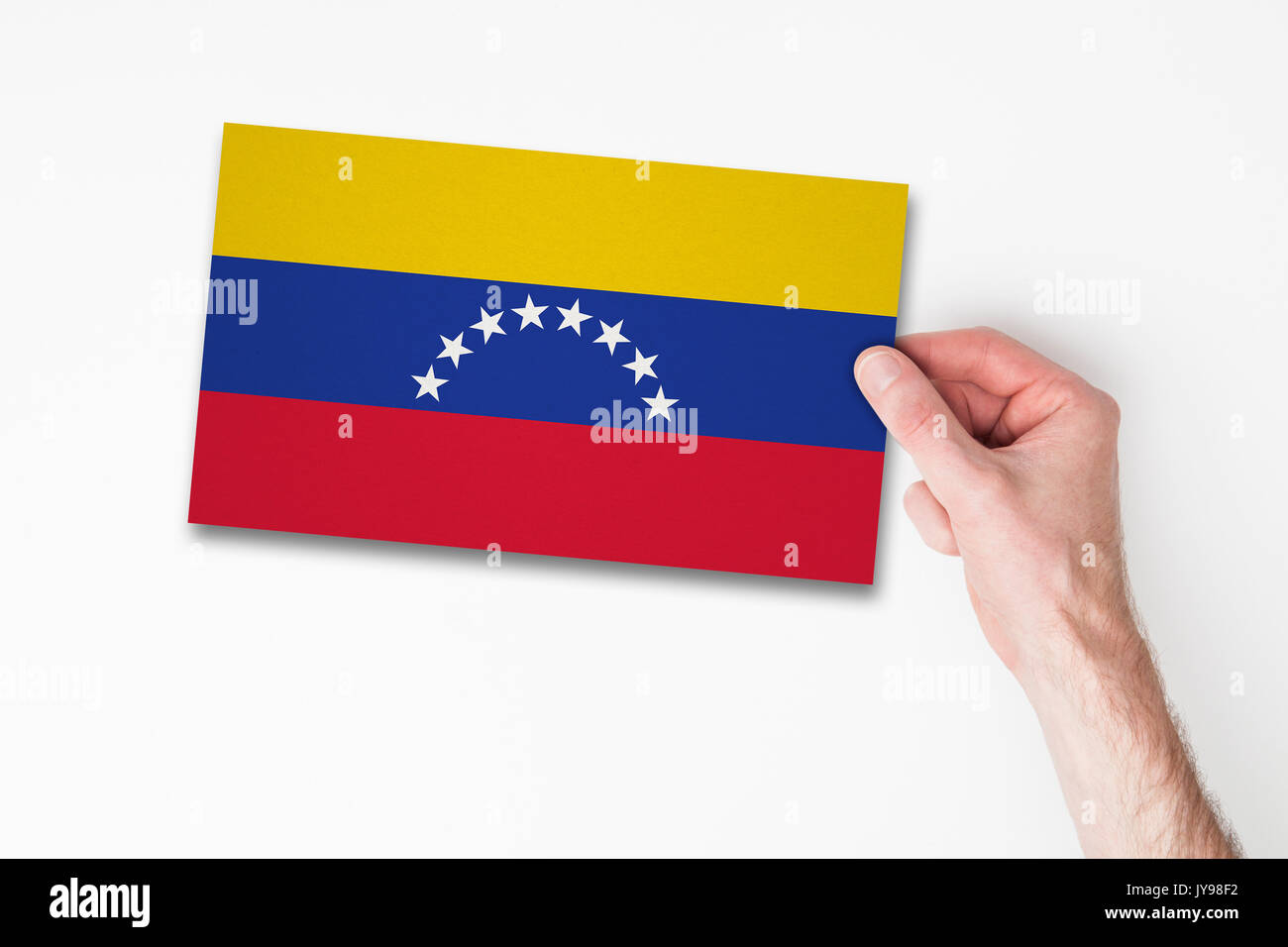 Male hand holding venezuela flag Stock Photo - Alamy