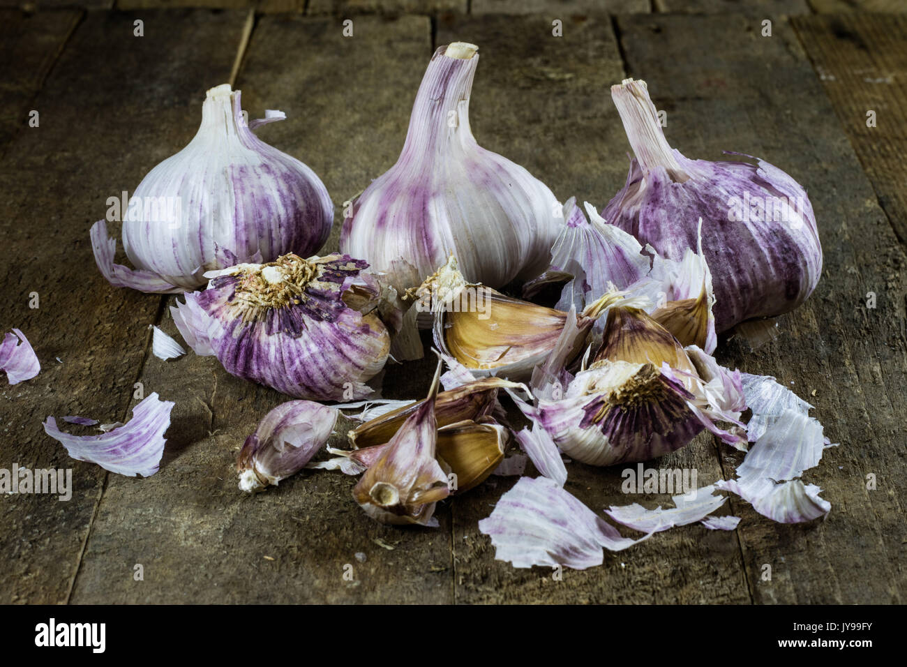 Tasty Italian garlic in an old kitchen on a wooden table, vintage style ...