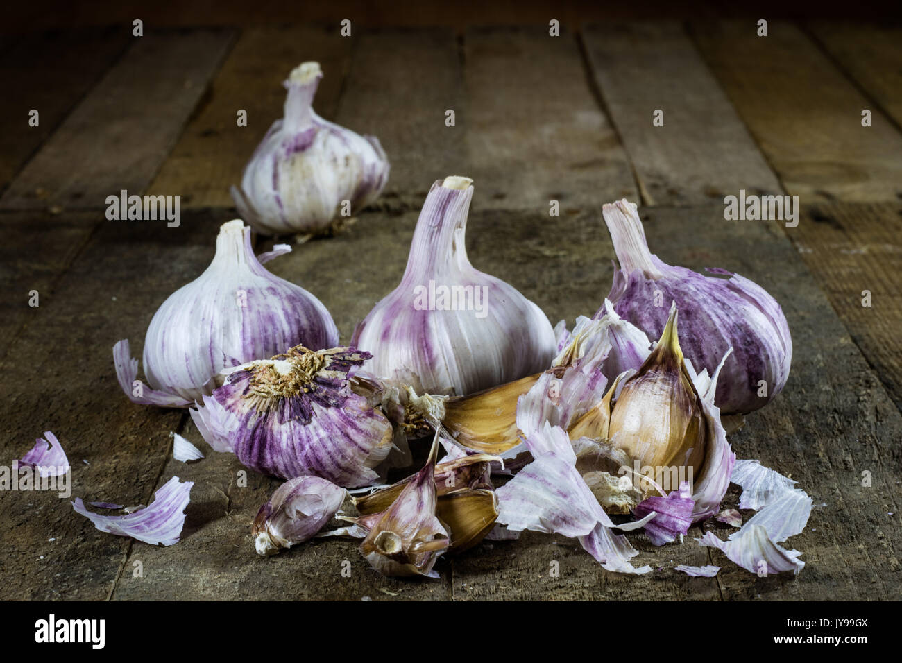 Tasty Italian garlic in an old kitchen on a wooden table, vintage style ...