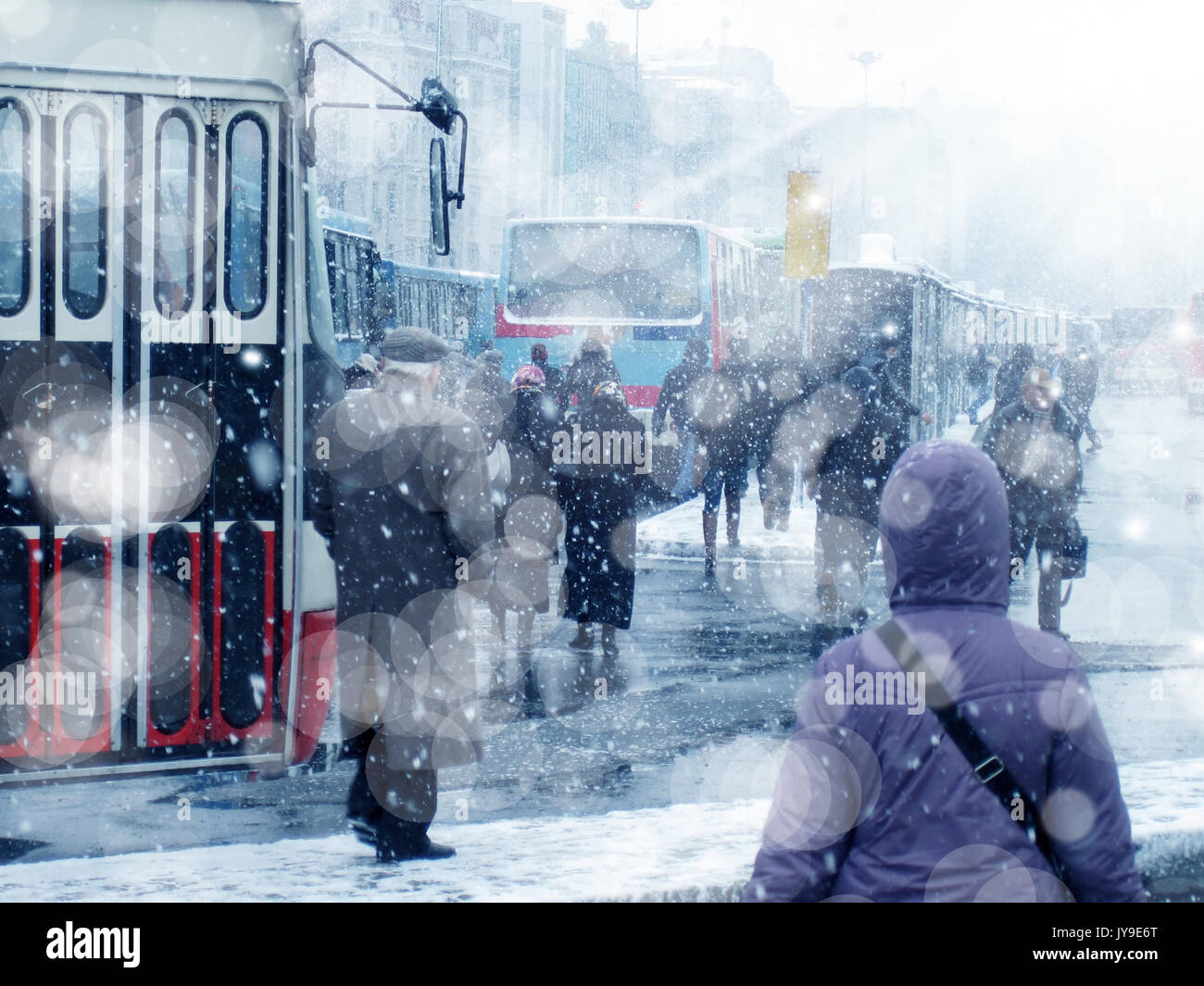 people walking on city street under snowing Stock Photo - Alamy