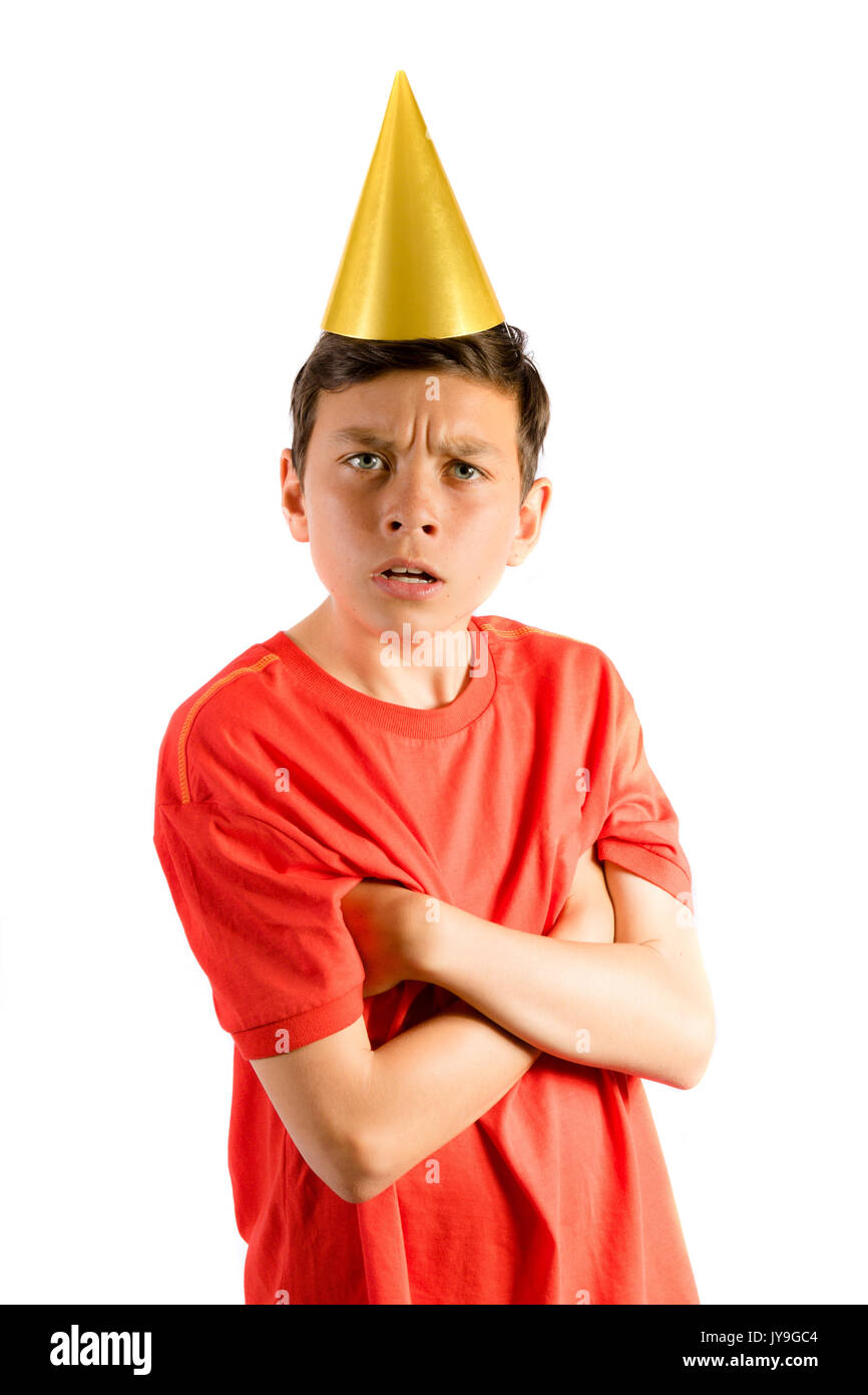 Young teenage boy isolated on white looking cross at a party Stock ...