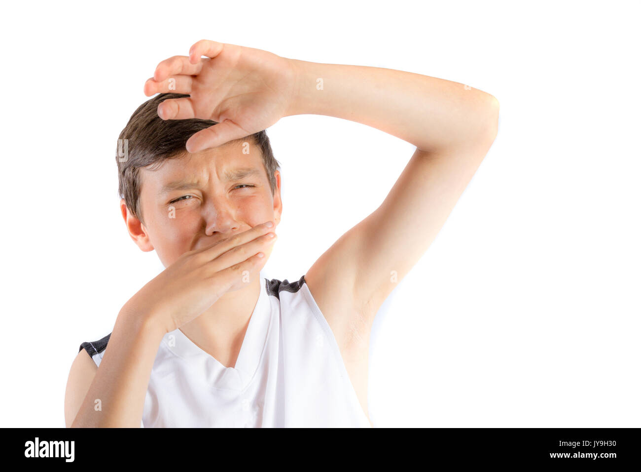 Young teenage boy isolated on a white background with smelly armpit ...