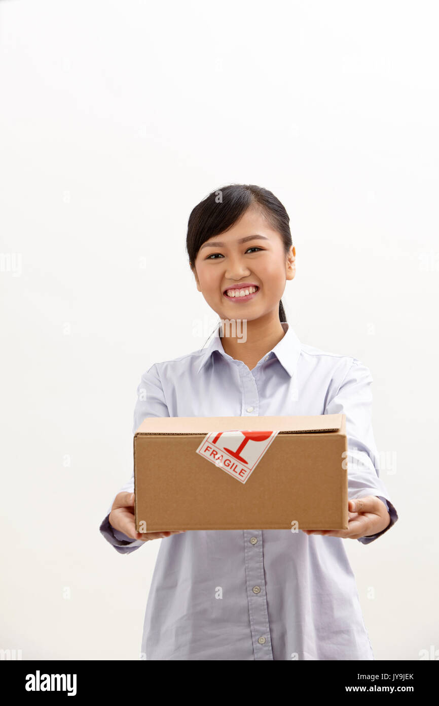 woman happy holding a brown box Stock Photo - Alamy