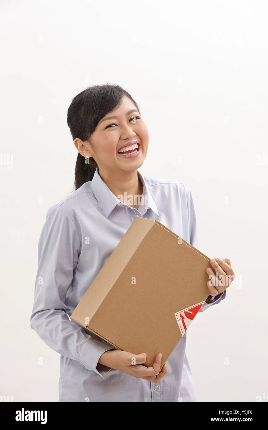woman happy holding a brown box Stock Photo - Alamy