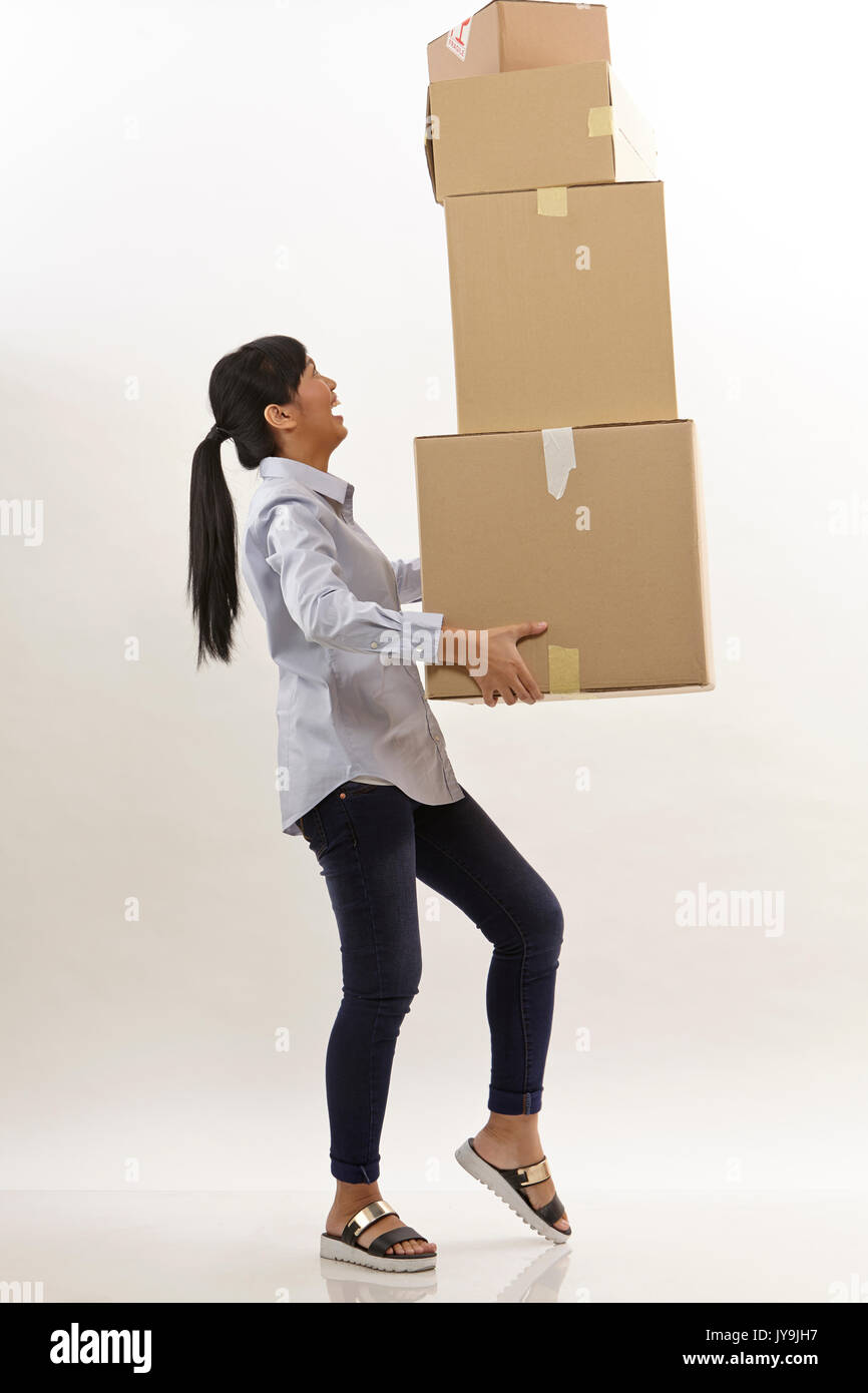 asian woman carrying stack of boxes Stock Photo - Alamy