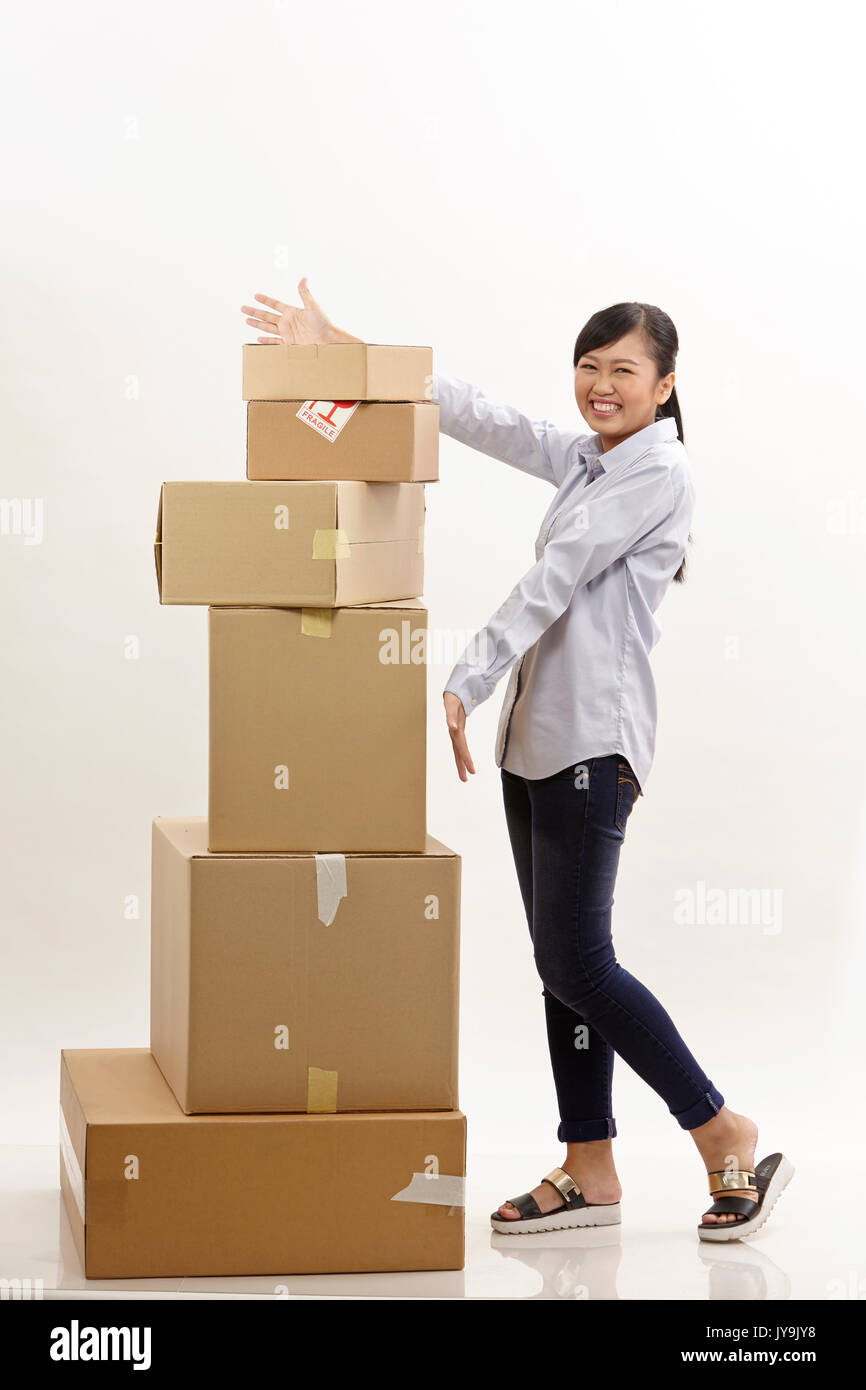 asian woman with stack of boxes on the white background Stock Photo - Alamy