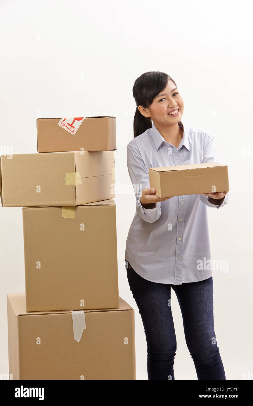 asian woman with stack of boxes on the white background Stock Photo - Alamy
